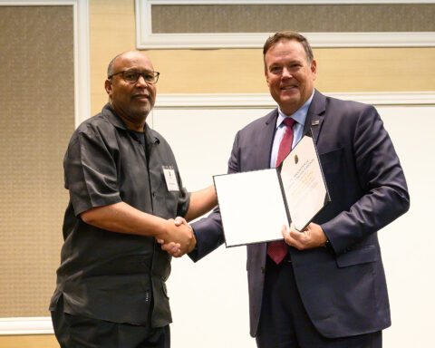 PRM Partner Terry Parham receiving an award recognizing PRM’s many ...